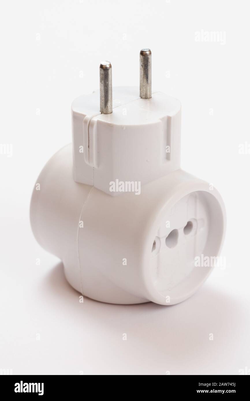 Plastic electrical tee connector with three sockets on a white ...