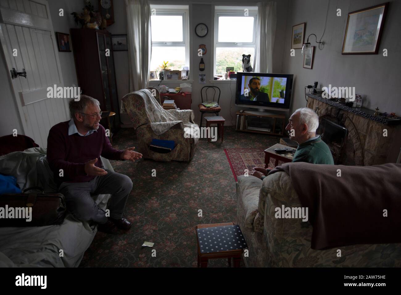 GP Dr David Binnie chatting to patient Walter Williams at his home at ...
