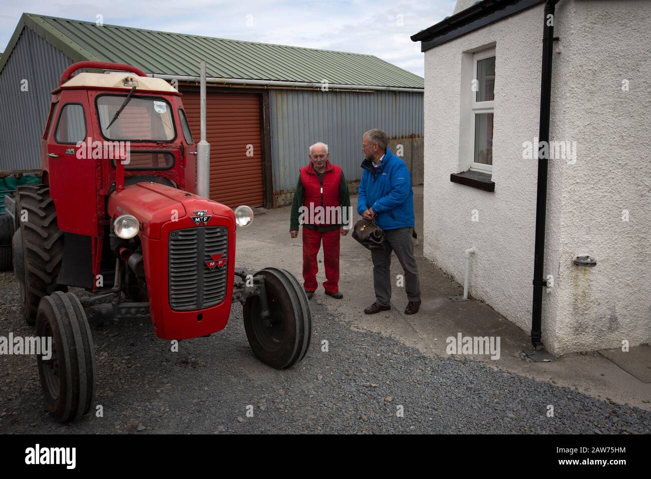 GP Dr David Binnie chatting to patient Walter Williams at his home at ...