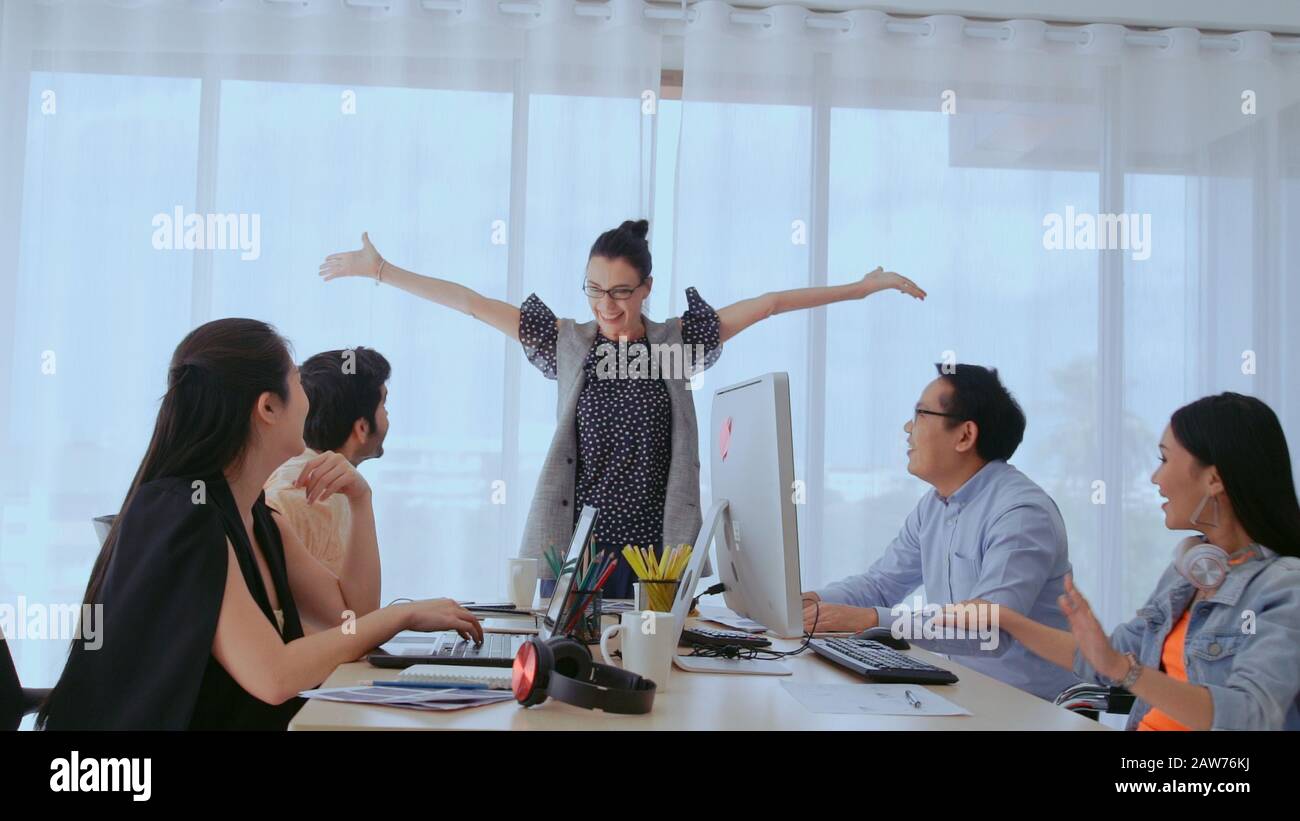 Successful business people group celebrating project success at office ...