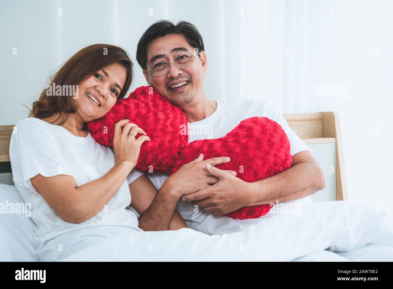 Happy Asian Senior Couple Having Good Time At Home Old People