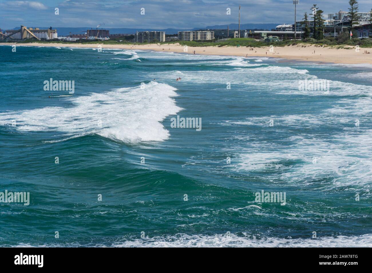 Picturesque seascape with sandy beach and unidentifiable incidental ...