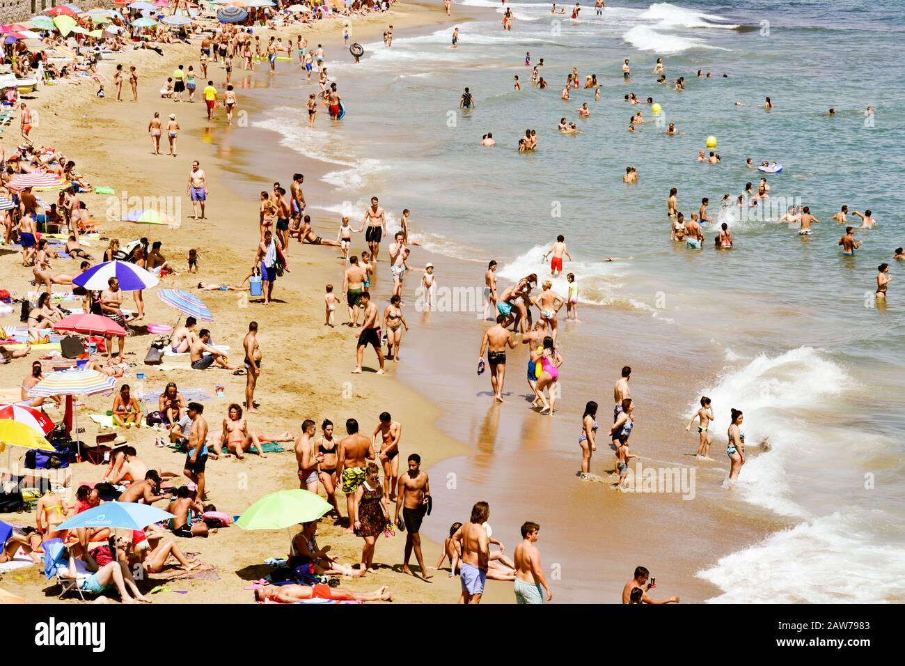 SITGES, SPAIN - JULY 9, 2017: People enjoying, relaxing, sunbathing or ...