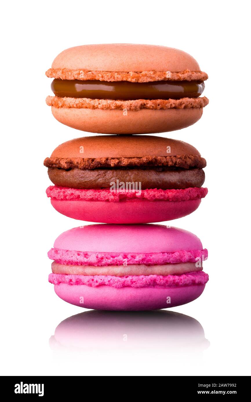 Stack of french colorful macaroons on table isolated on white ...