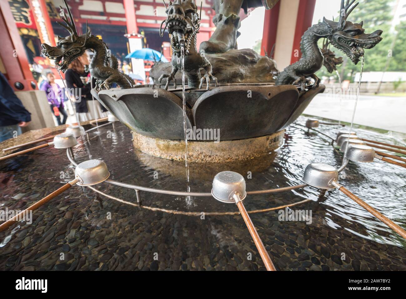 Tokyo, Japan - August 29, 2016: Chozuya fountain with dragon sculptures ...