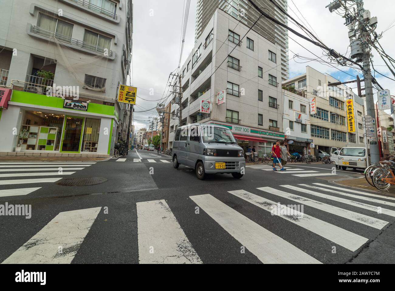 Tokyo, Japan - August 29, 2016: Pedestrians and car on pedestrian ...