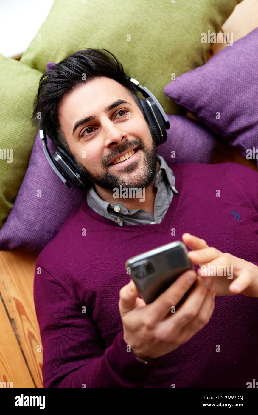 Man headphones laughing hi-res stock photography and images - Alamy