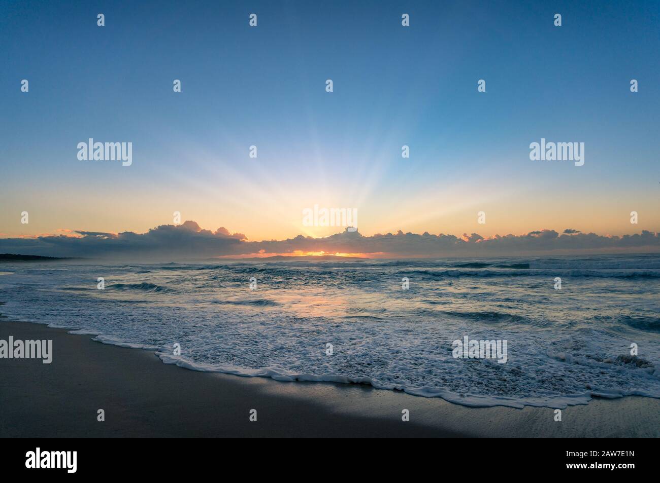 Beach landscape with soft waves on the shore and sun with beautiful ...