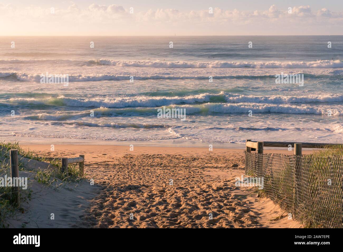 Entrance to the beach with beautiful ocean waves at sunrise. Summer ...