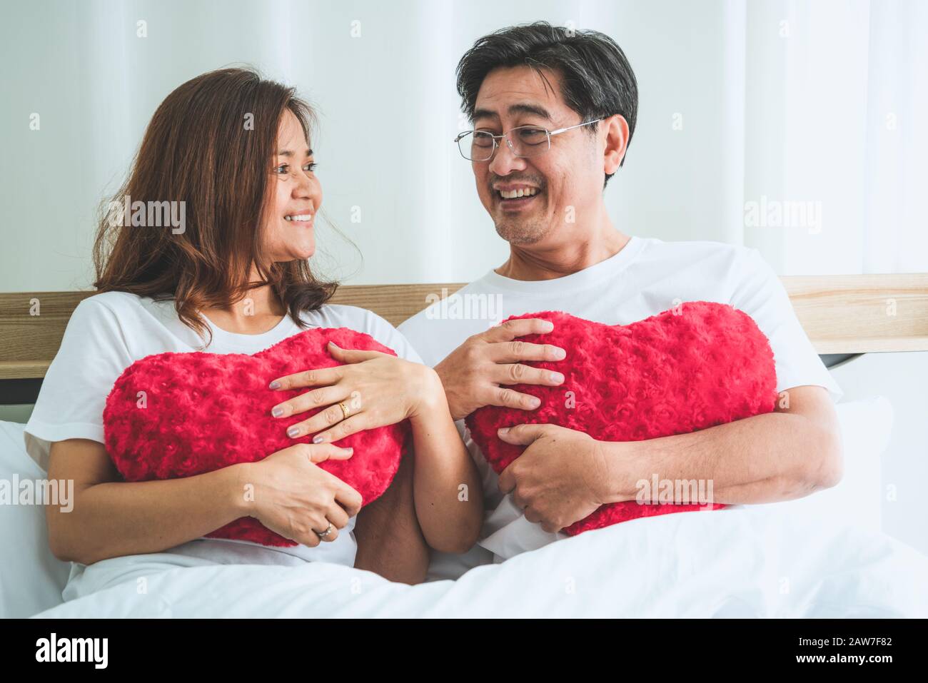 Happy Asian Senior Couple Having Good Time At Home Old People
