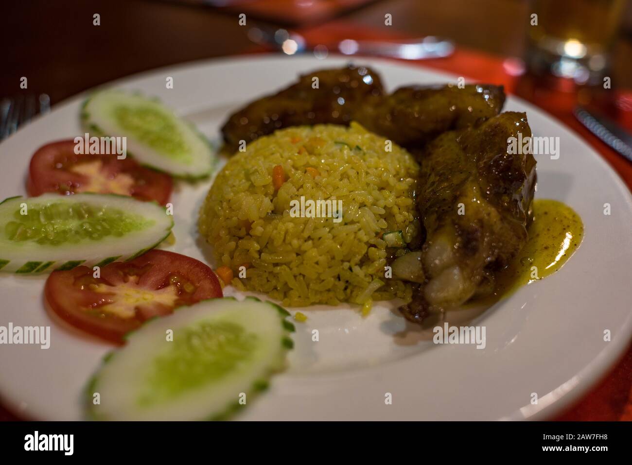 Fried rice served with meat and vegetables. Dinner, lunch meal Stock ...