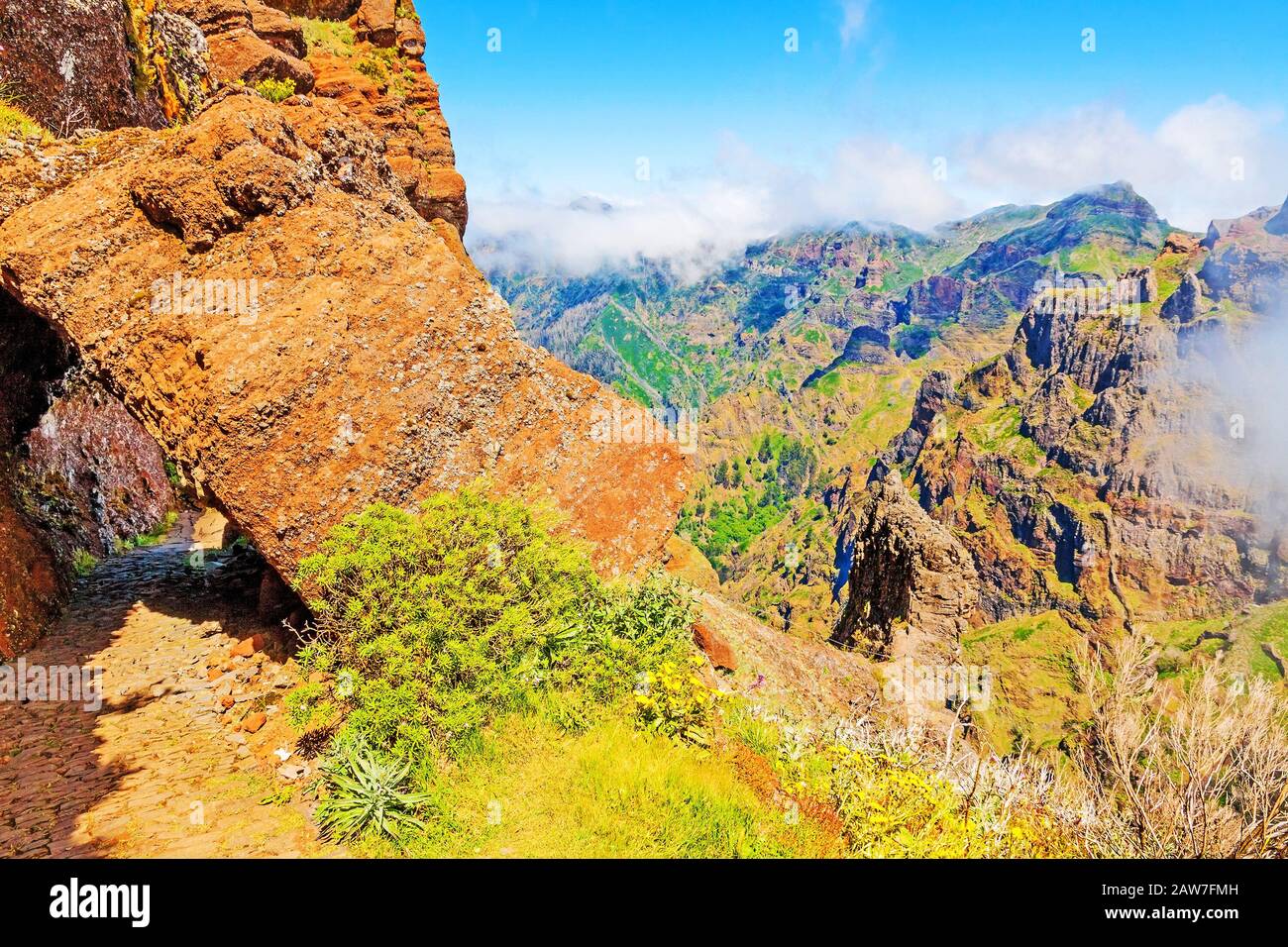 Colorful volcanic mountain landscape with clouds - hiking path from ...
