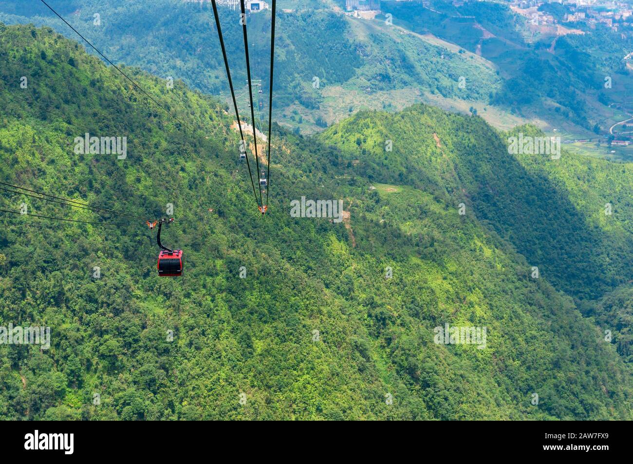 Cable car riding over green mountain forest. Travel adventures ...