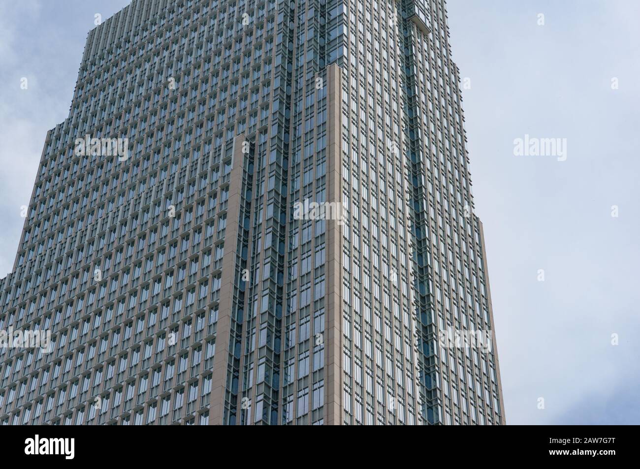 Perspective view of tall skyscraper building with rows of windows ...