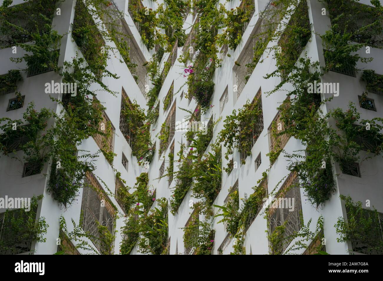 Green building architecture background. Building with green plants in ...