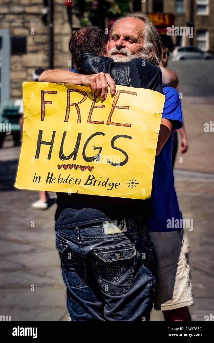 Man giving out free hugs Stock Photo - Alamy