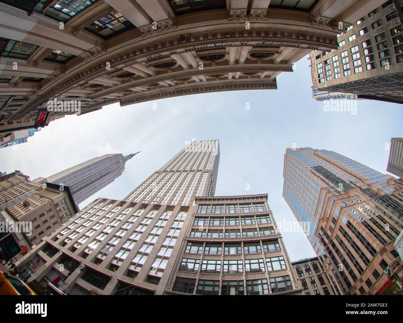 Wide angle shot of skyscrapers and Empire State Building from the road ...