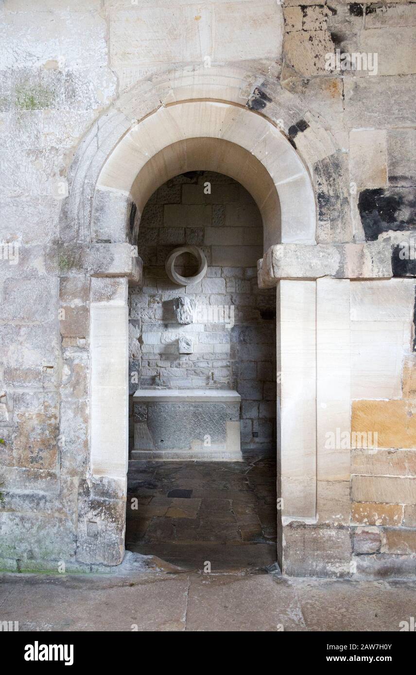 Interior stone arch leading to altar inside Saxon church of Saint ...
