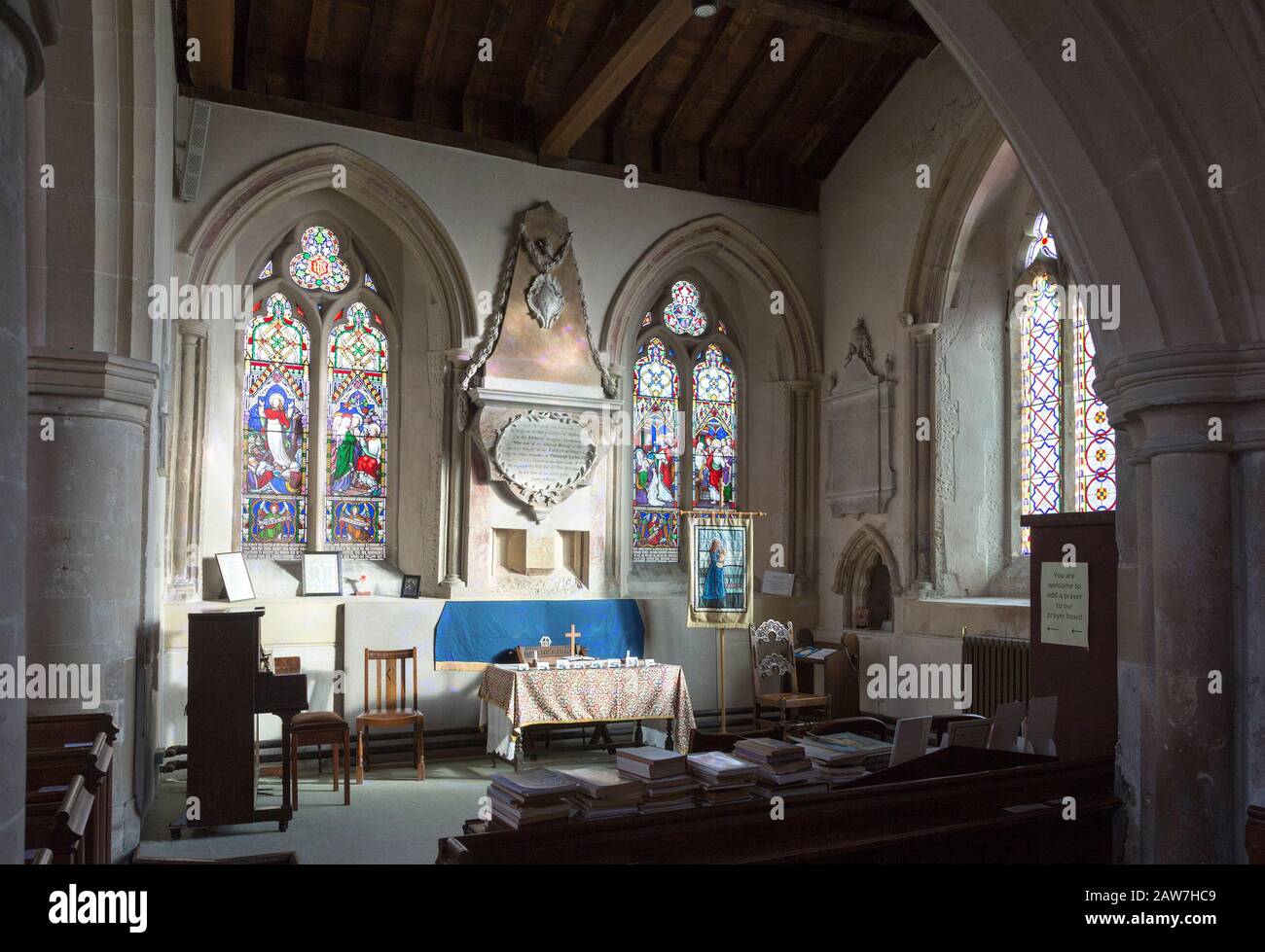 Side chapel altar, stained glass windows inside the church at Urchfont ...