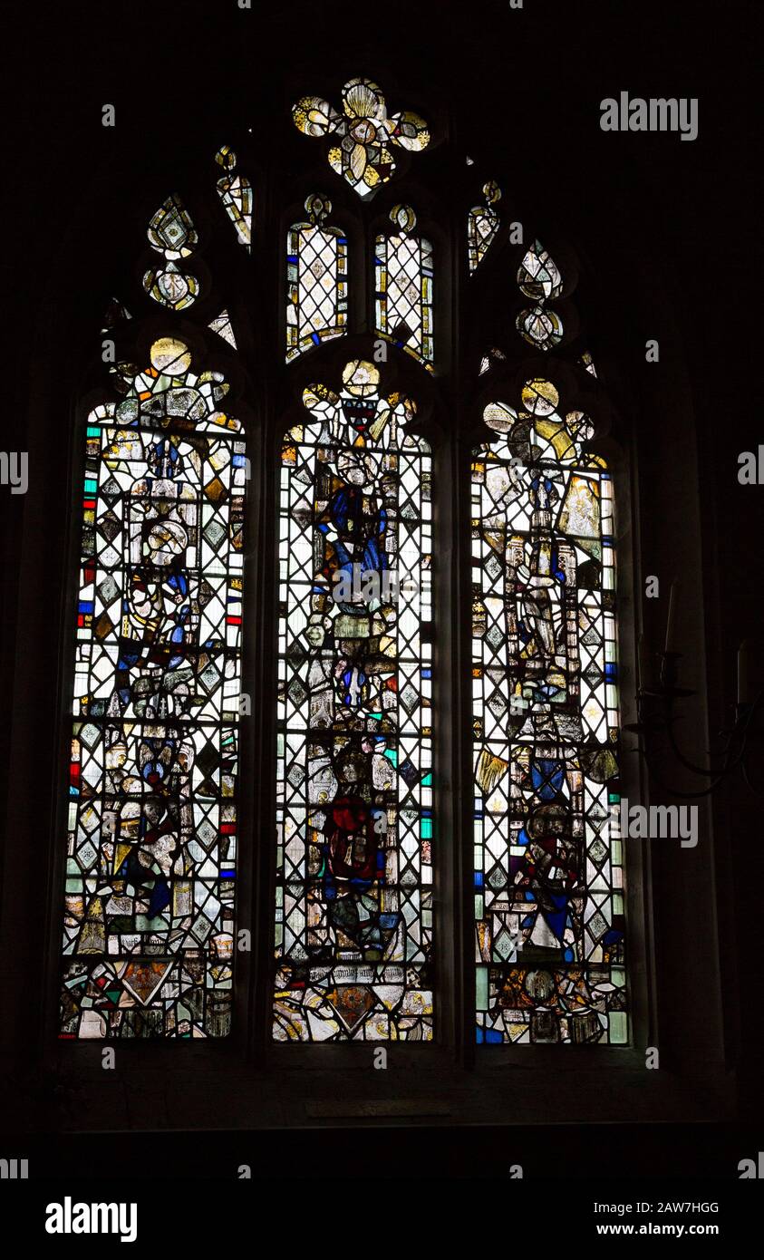 Fragments of medieval stained glass used to form a window inside church ...