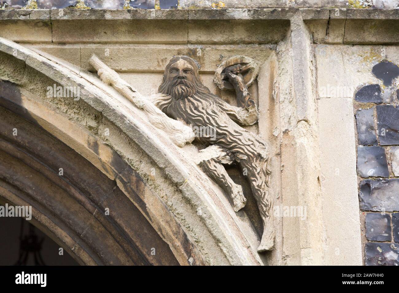 Mythological folklore figure woodwose wild man carved in stone on the ...
