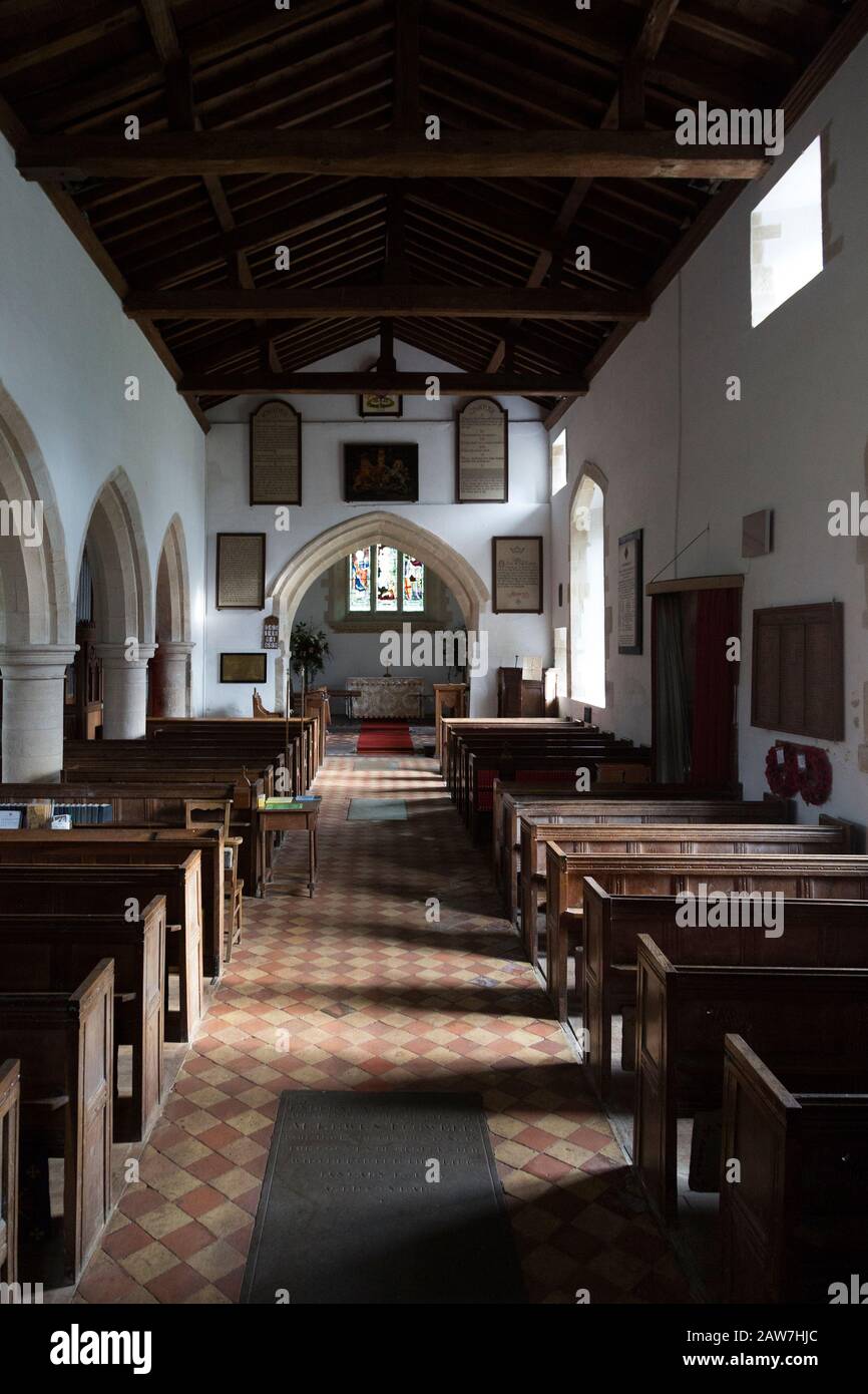 View past wooden pews to chancel arch and altar in sanctuary in the ...