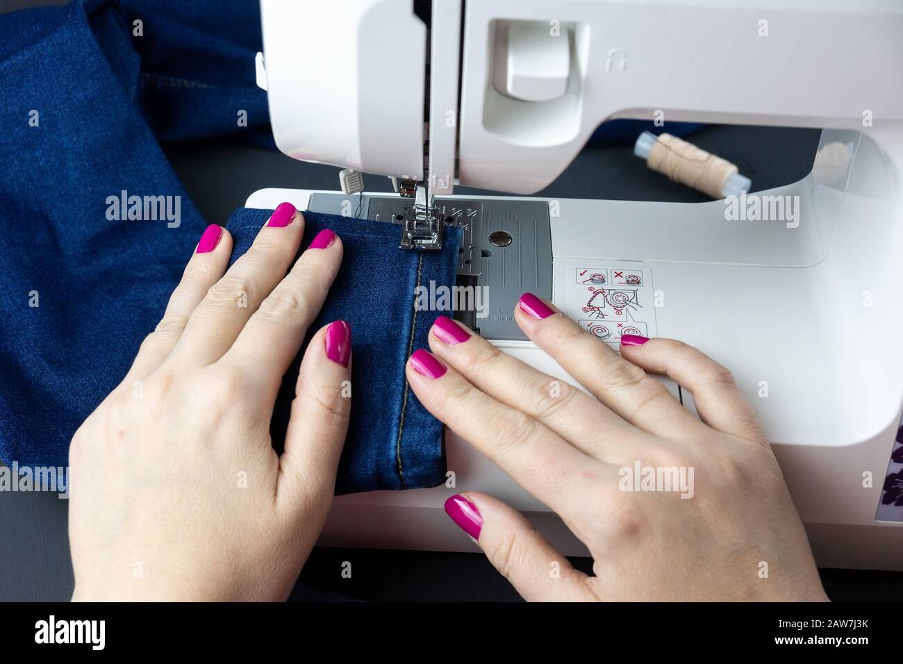 Womans hand sewing on machine hi-res stock photography and images - Alamy