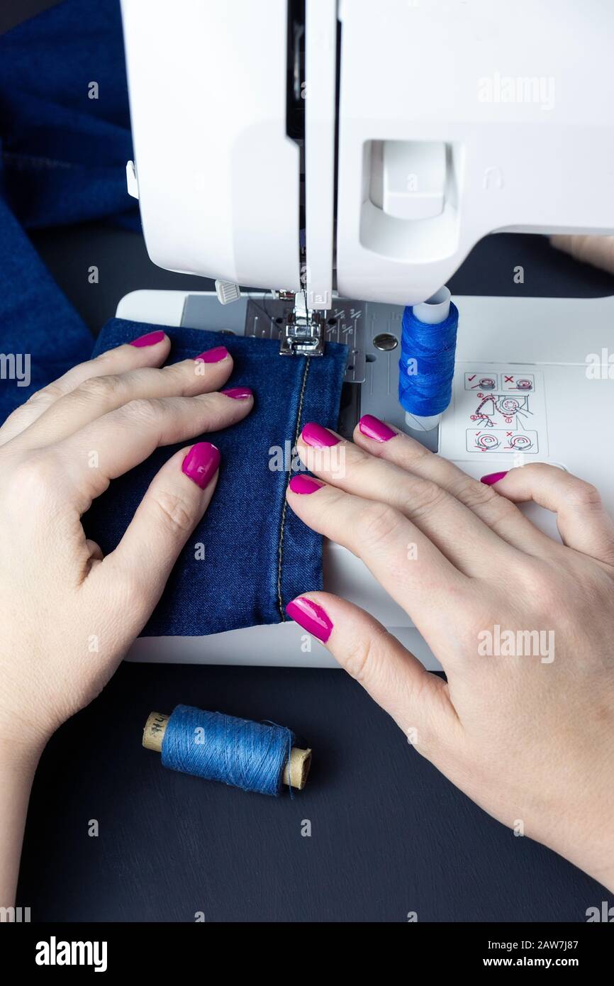 Womans hand sewing on machine hi-res stock photography and images - Alamy
