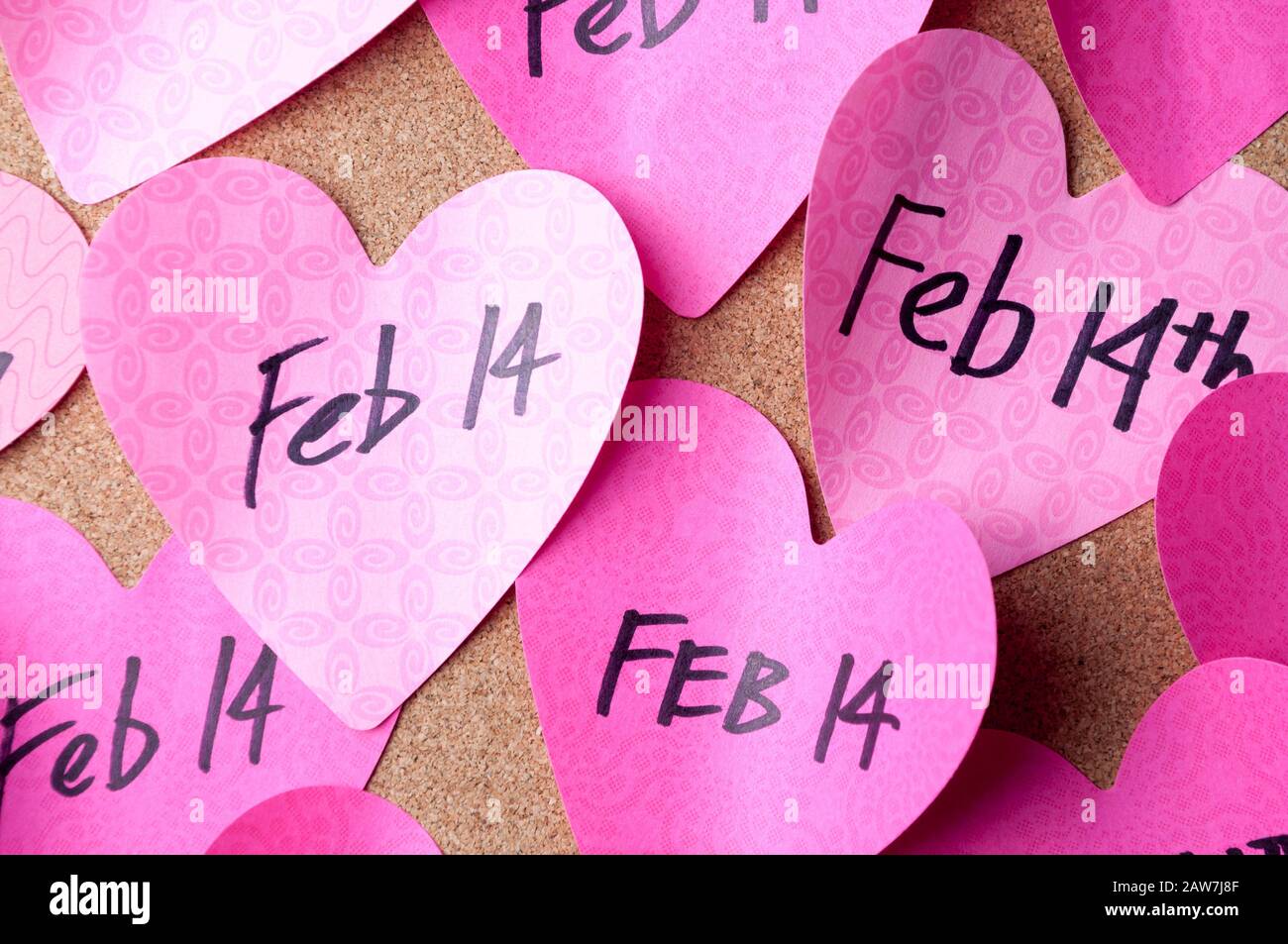 Flurry of sticky pink hearts on bulletin board with reminder of Feb ...