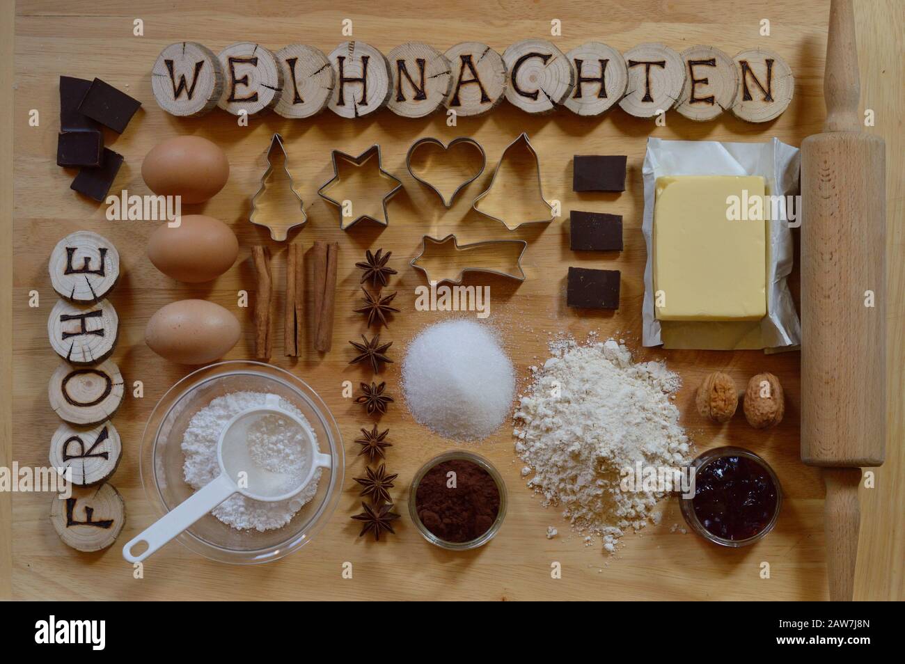 Baking ingredients for christmas cookies with wooden pieces and the ...