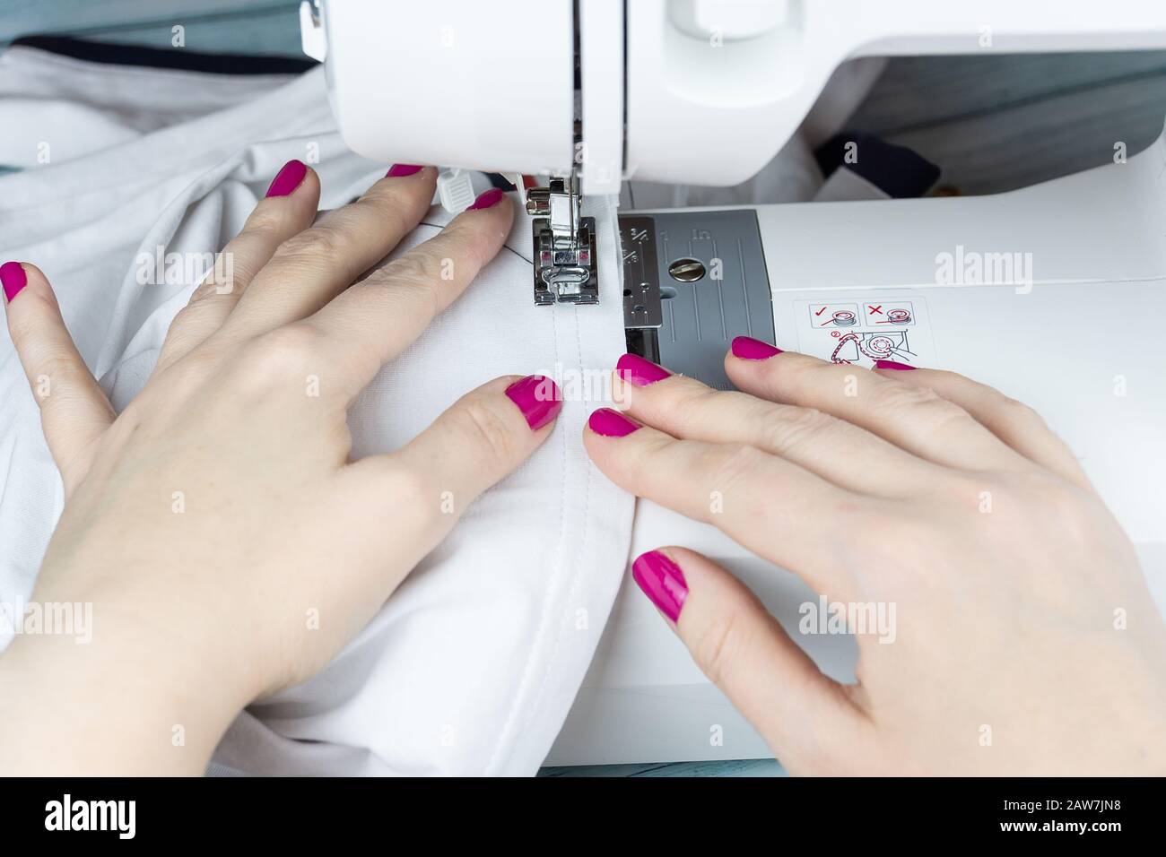 Womans hand sewing on machine hi-res stock photography and images - Alamy
