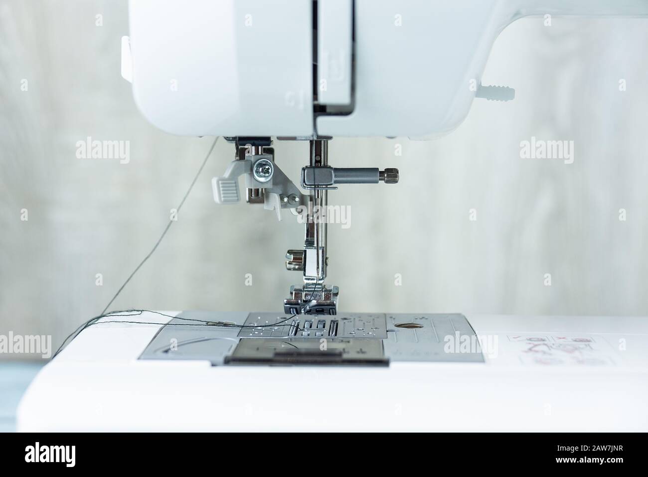 Womans hand sewing on machine hi-res stock photography and images - Alamy
