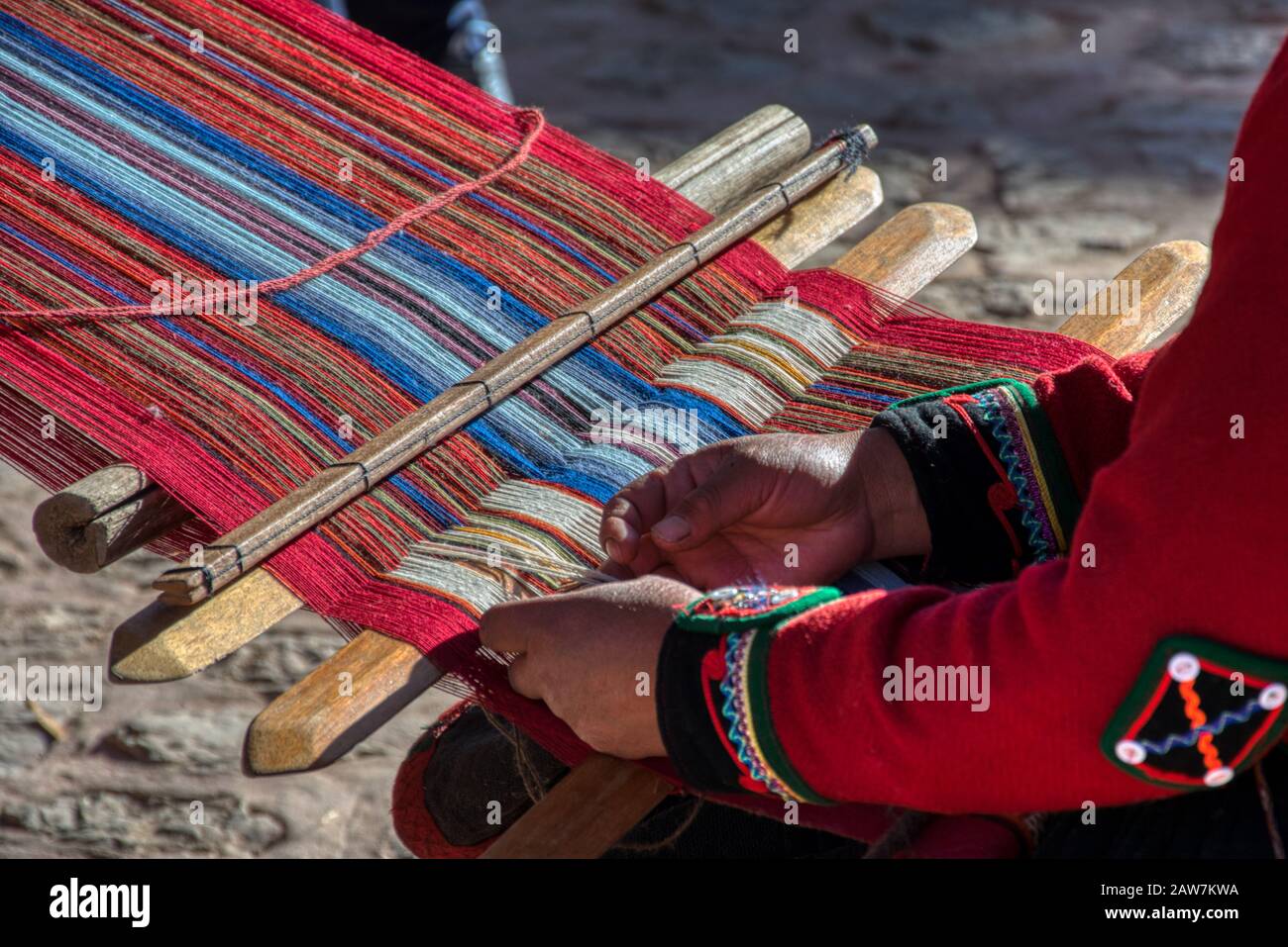 Close-up of weaving by a Peruvian woman in traditional dress Stock ...