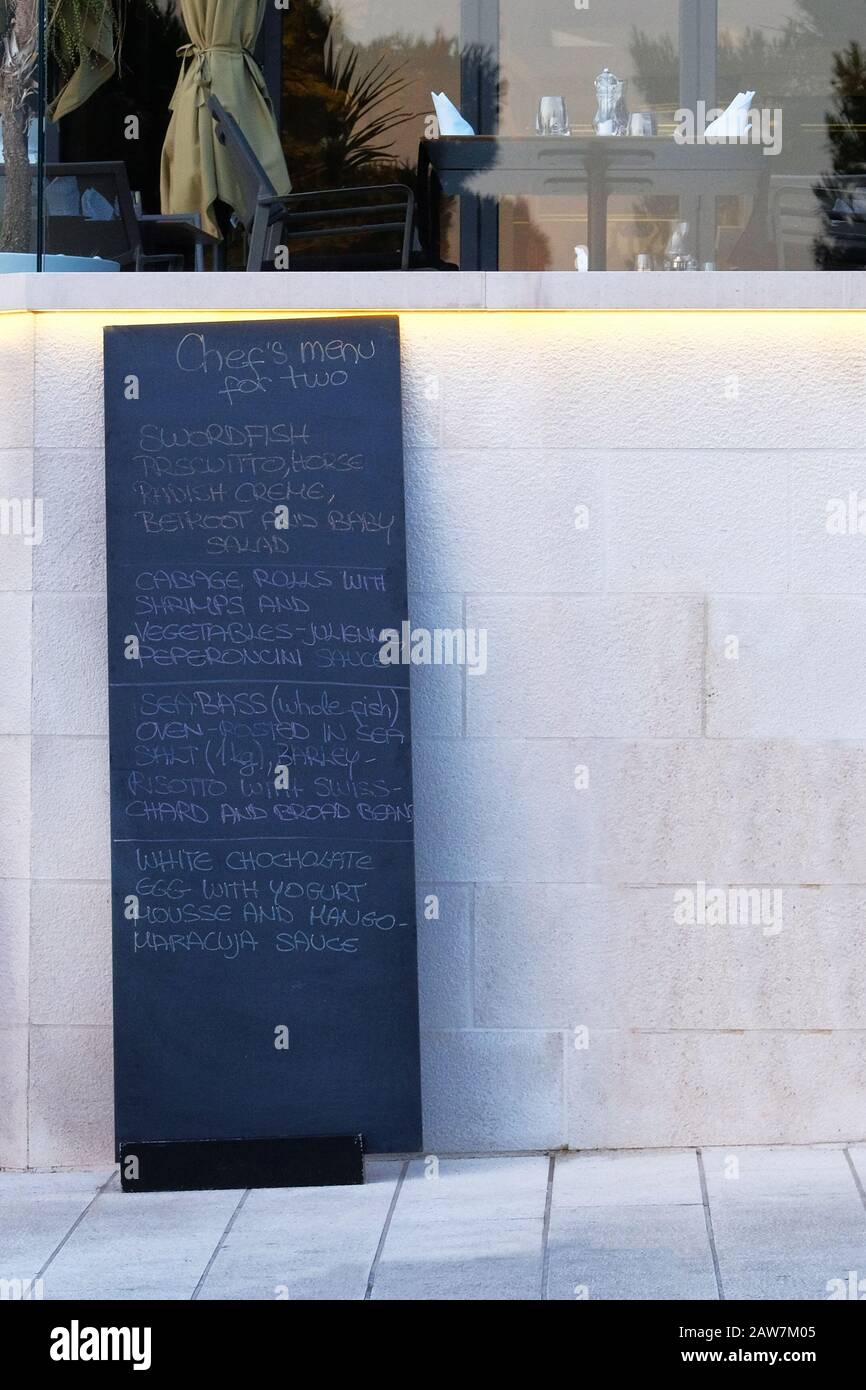 Menu board of cafe or restaurant. Whiteboard with text of menu in an ...