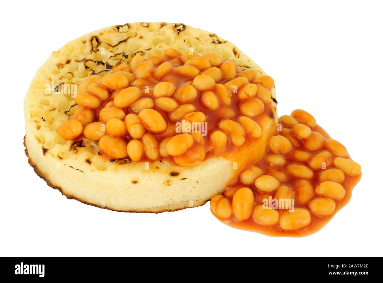 Baked beans on a large English crumpet isolated on a white background ...
