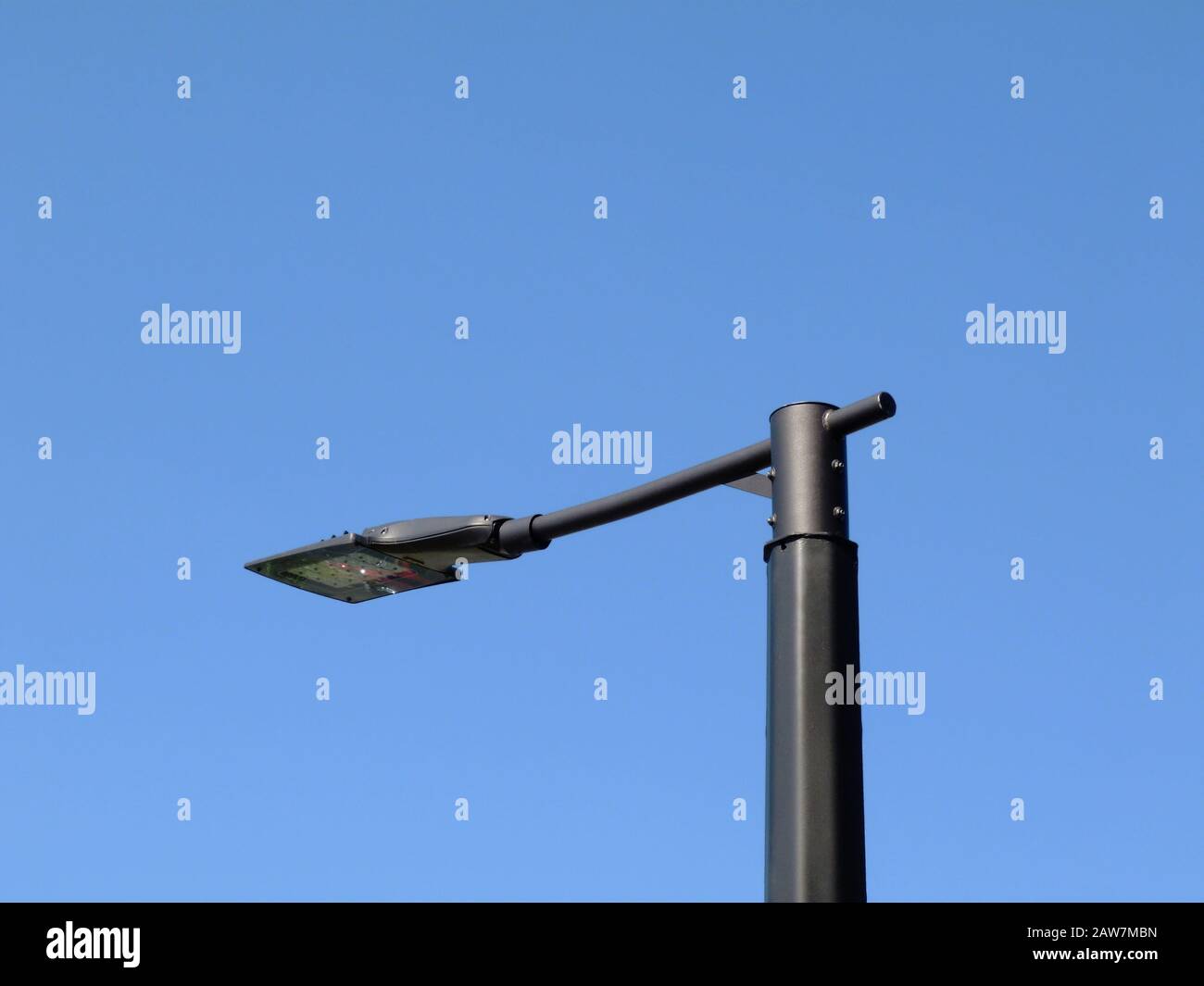 Modern square head LED street lamp detail. clear blue sky. Abstract low ...