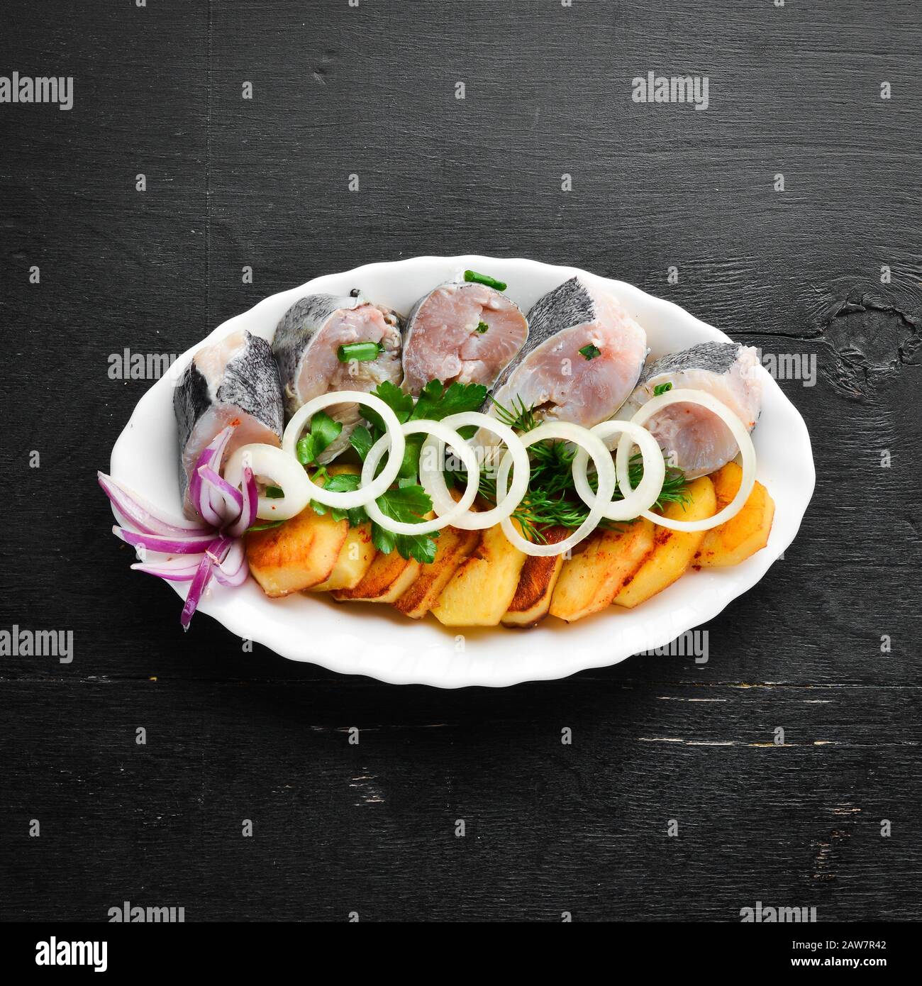 Salted fish with potatoes and onions. Ukrainian Traditional Cuisine. On ...