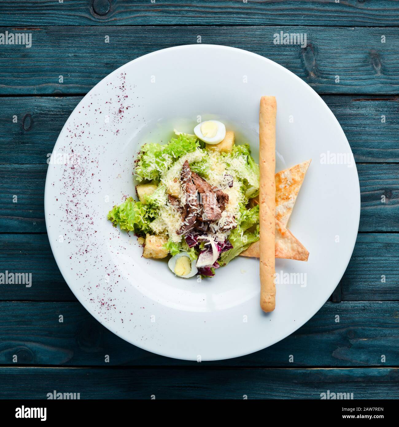 Vegetable Caesar Salad with Veal. In the plate. Top view. Free space ...