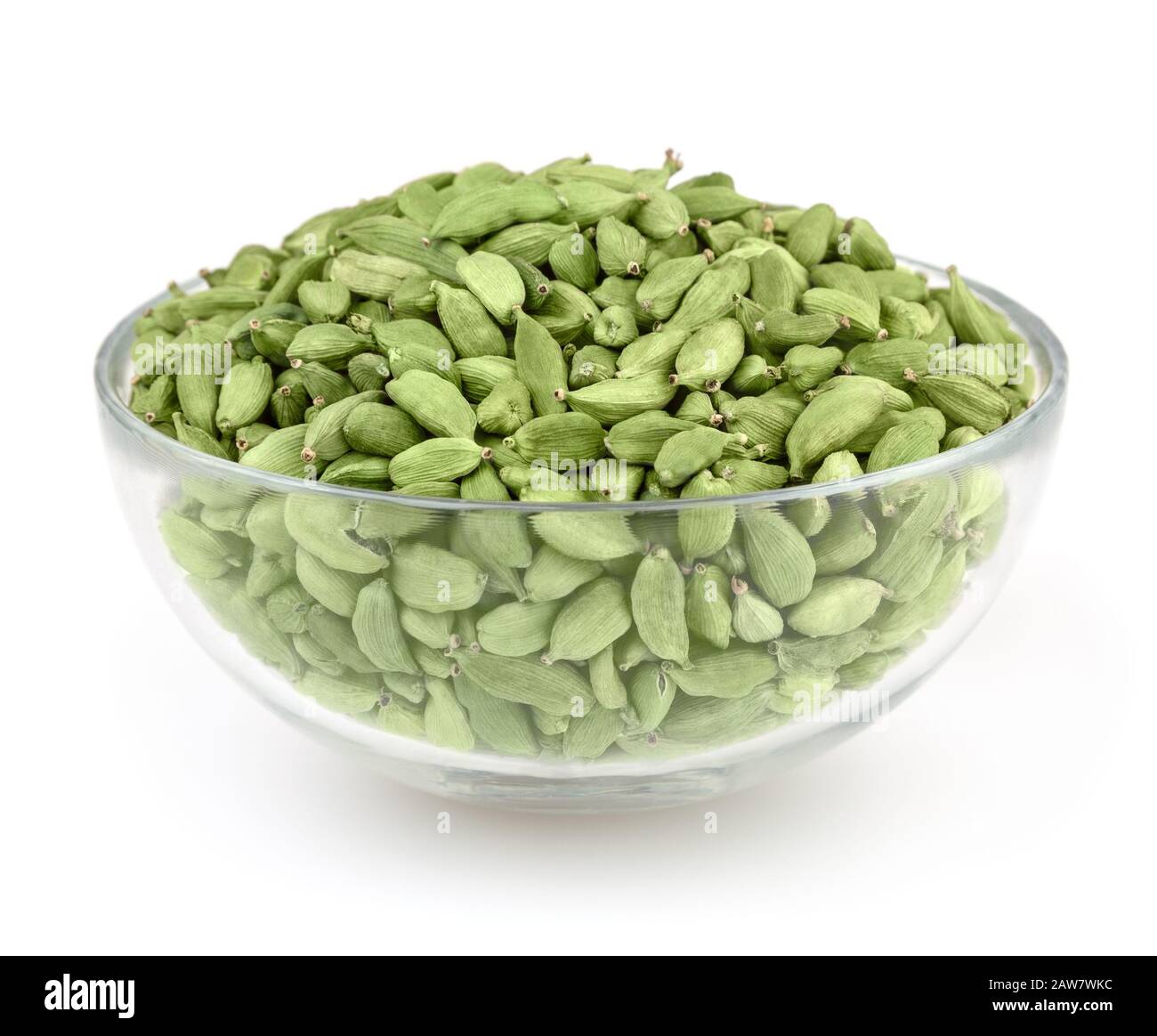 Green cardamon pods in glass bowl isolated on white background Stock ...
