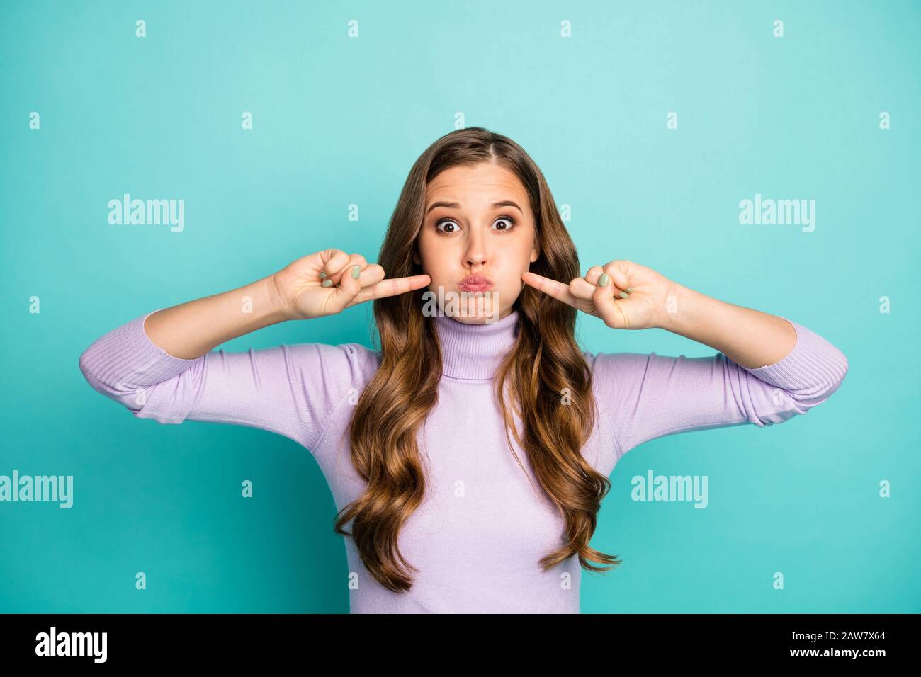 Pressing cheeks hi-res stock photography and images - Alamy
