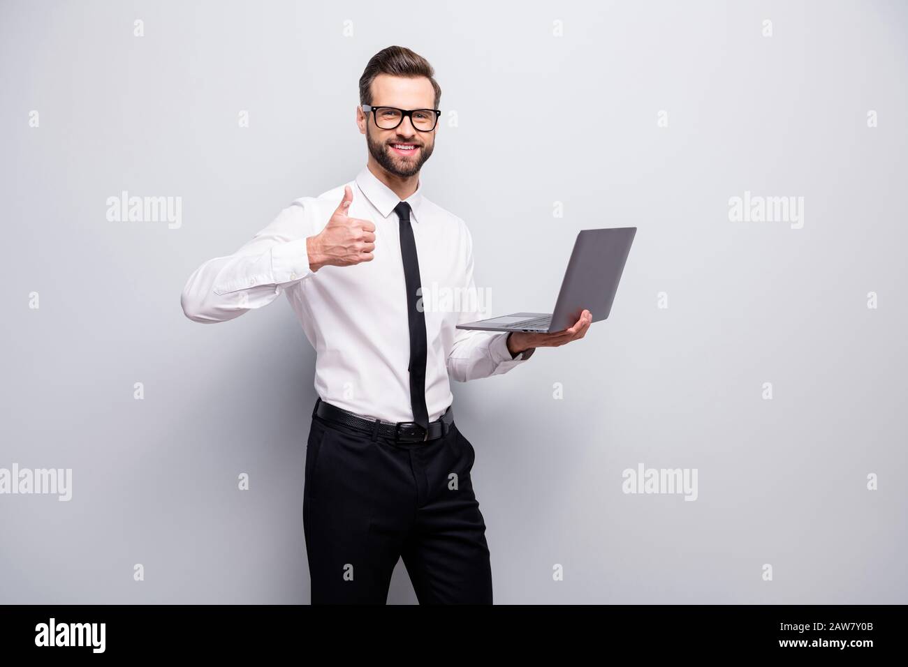 Portrait of confident cool smart man executive work on computer approve ...