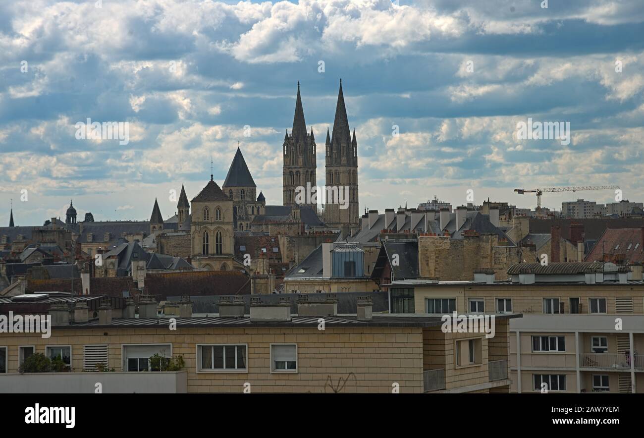 Cityscape of French city Caen with high tower of an catholic cathedral ...