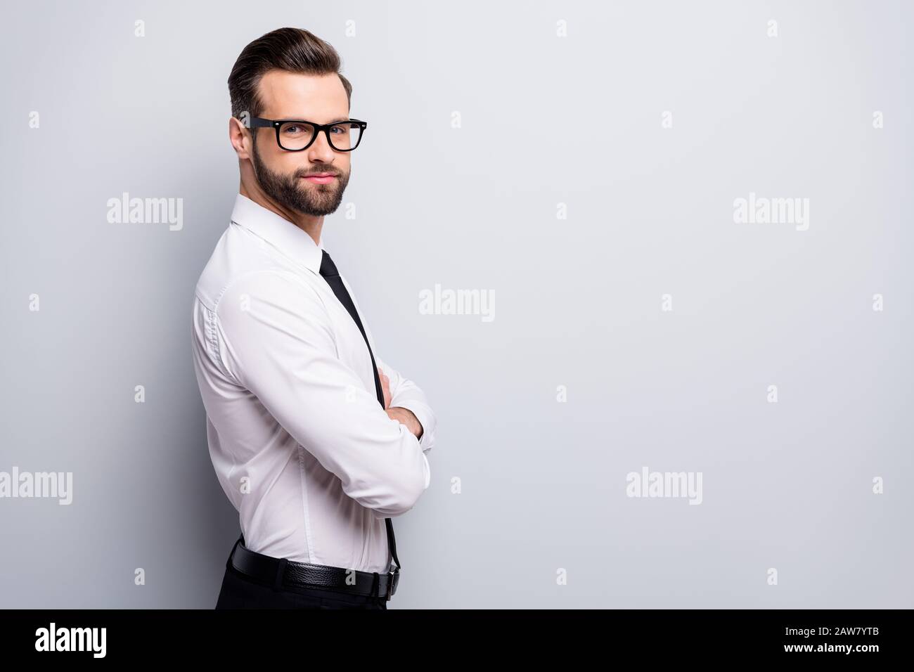 Profile photo of young handsome serious business man bossy crossed arms ...