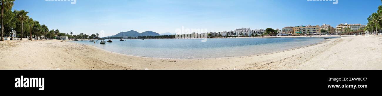 Beach panorama of Alcudia with hotels, promenade and beach with water ...