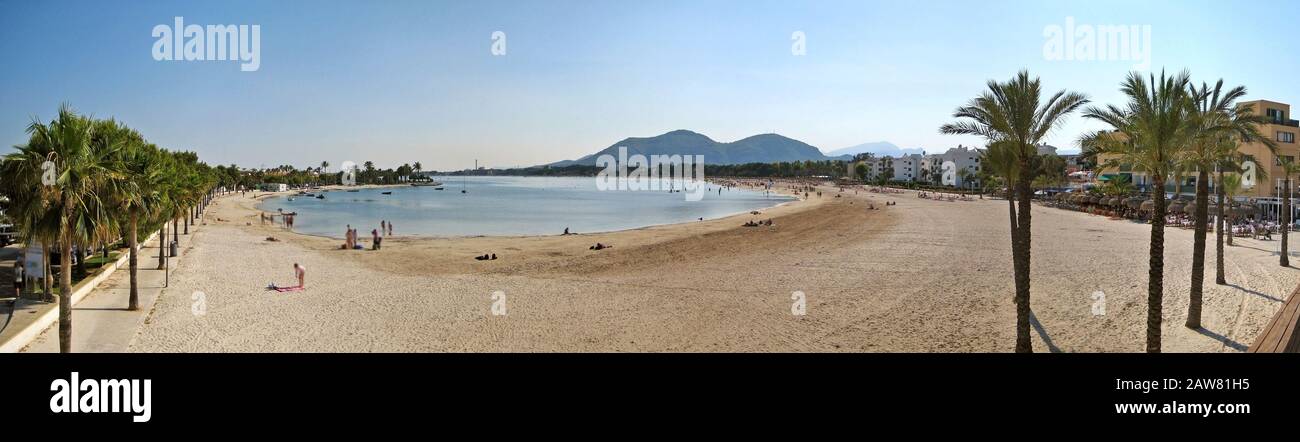 Beach panorama of Alcudia with hotels on the right and promenade with ...