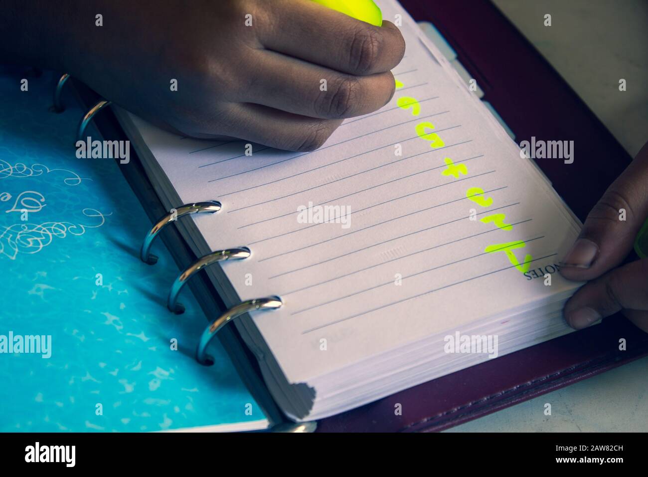 Kid writing numbers in a notepad with a marker Stock Photo - Alamy