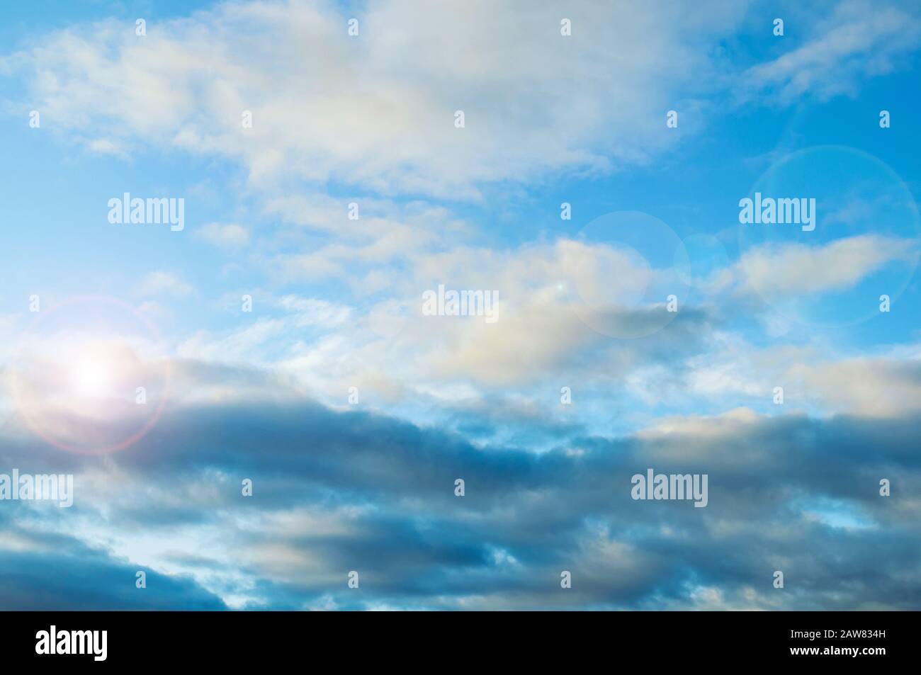 Dramatic blue sky background. Picturesque colorful clouds lit by ...