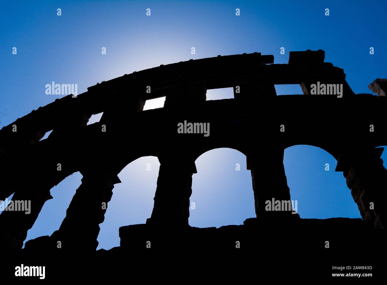 silhouette of the ancient amphitheater in pula croatia with blue sky ...