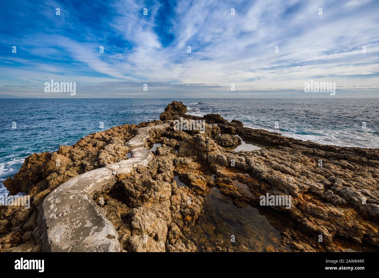 Cap d'Antibes rough sea waves splashing on the cliffs Stock Photo - Alamy