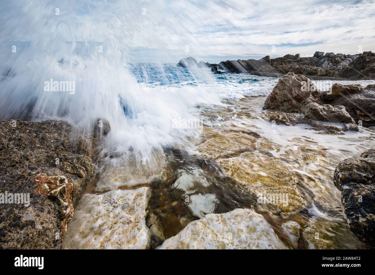 Cap d'Antibes rough sea waves splashing on the cliffs Stock Photo - Alamy